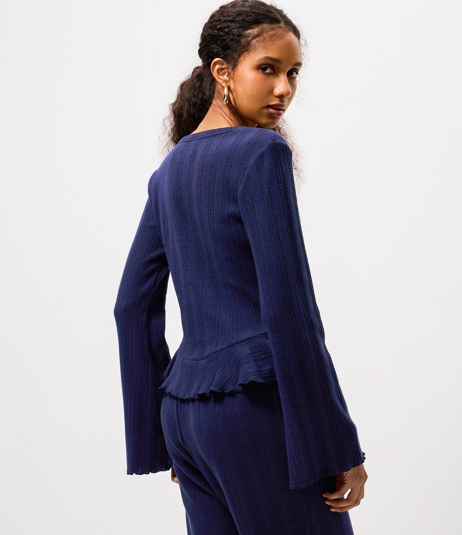 Blusa Peplum em Tricô Texturizado com Abotoamento Azul